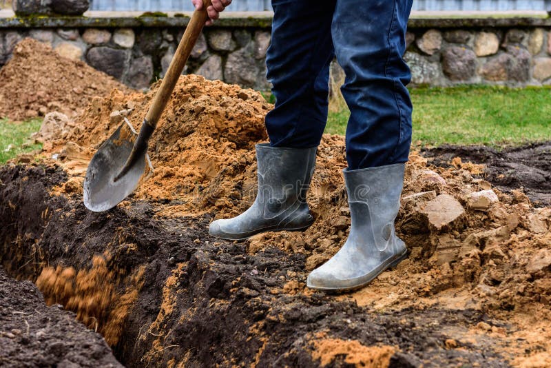 Earthworks, Man Digging Trench Using Shovel. Stock Photo - Image of ...