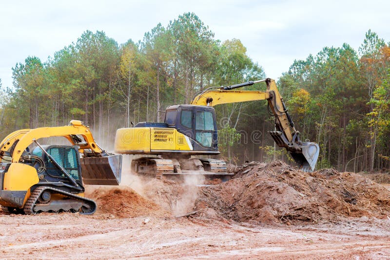 During an Earthworks Project, a Small Tractor is Used To Level Ground ...