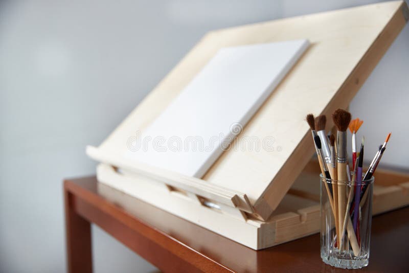 Easel with Artist S Brushes on the Table Stock Image - Image of brush ...