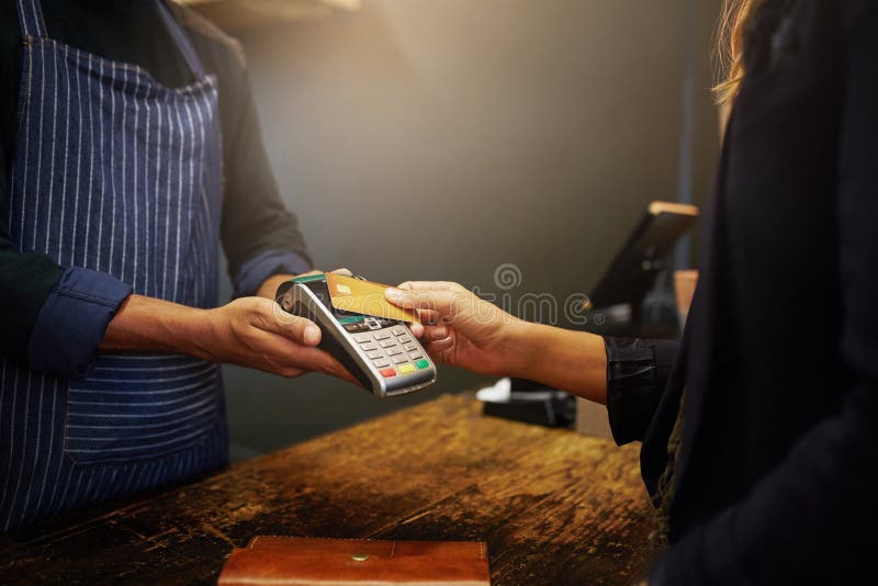 Easier Than Swiping. a Customer Paying Using NFC Technology in a Shop ... Easier Than Swiping. a Customer Paying Using NFC Technology in a Shop ...