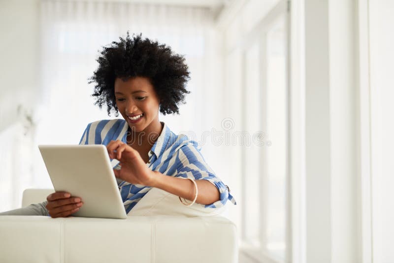 Easing into the Weekend. a Young Woman Working on Her Digital Tablet at ...