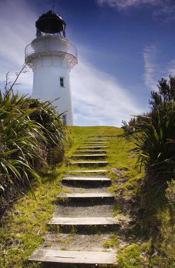 East Cape Lighthouse stock photo. Image of round, clouds - 15978252