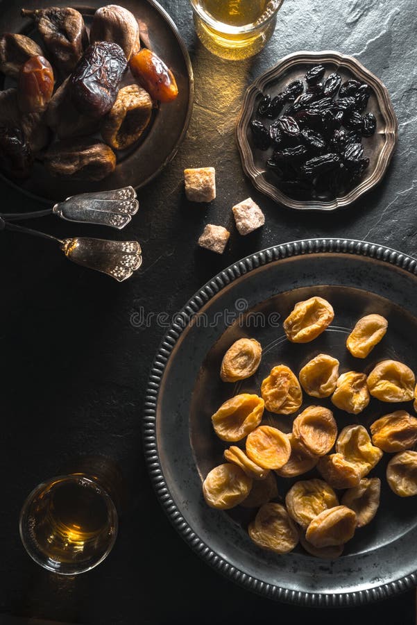East-style Tea-drinking with Dates, Dried Apricots on a Stone Table ...