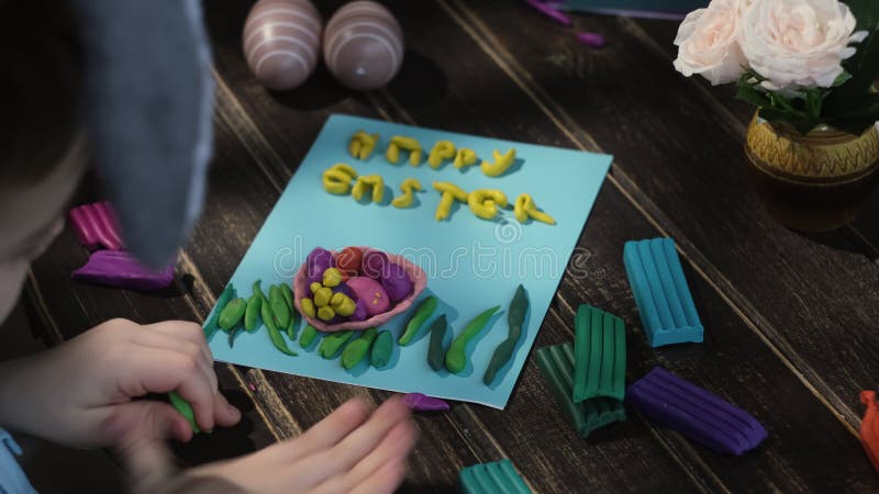 Easter Crafts. Child Working on Easter Card Using Plasticine. Stock ...