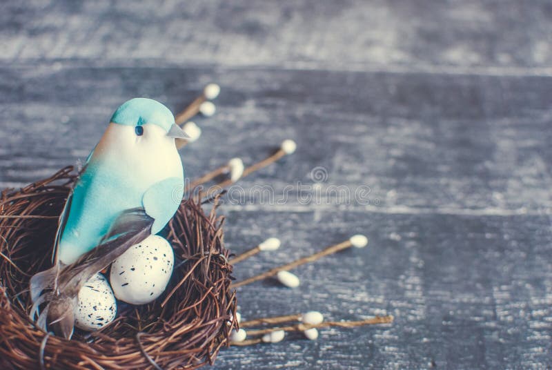 Easter Basket with Easter Eggs and Decorative Blue Bird on Wooden ...