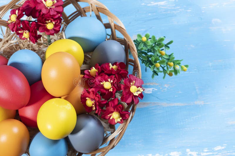 Easter Basket with Straw and Colored Eggs Stock Photo - Image of ...