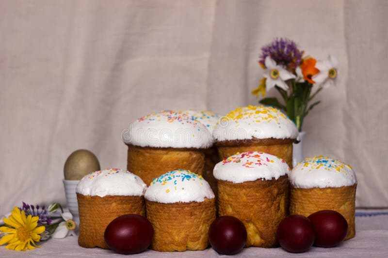 Easter Bread with Icing and Colourful Sprinkles on a Table with Easter ...