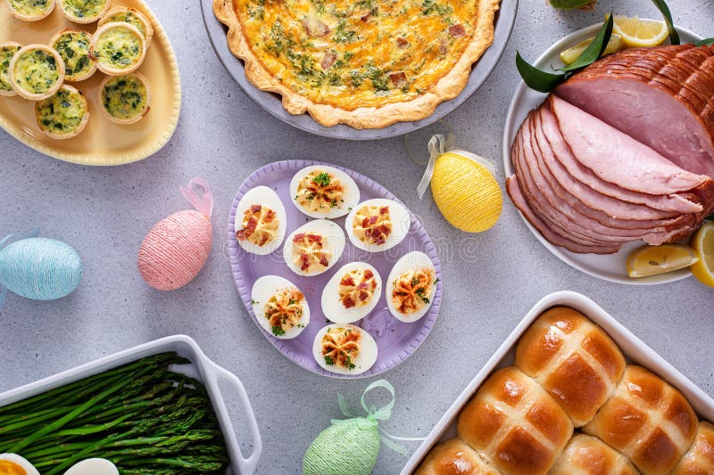 Easter Brunch Table with Ham, Quiche, Hot Cross Buns Stock Photo ...