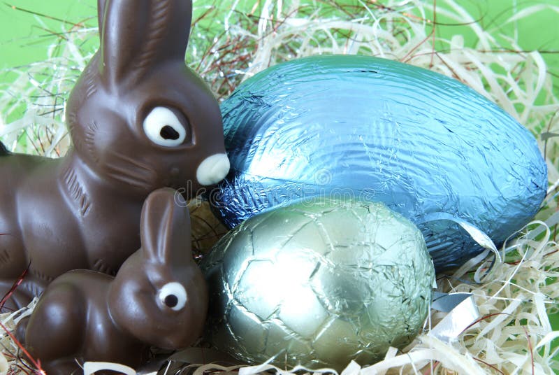 Easter bunnies and eggs stock image. Image of green, cacao - 4444499