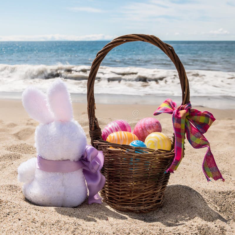 Easter Bunny with Color Eggs on the Ocean Beach Stock Photo - Image of ...