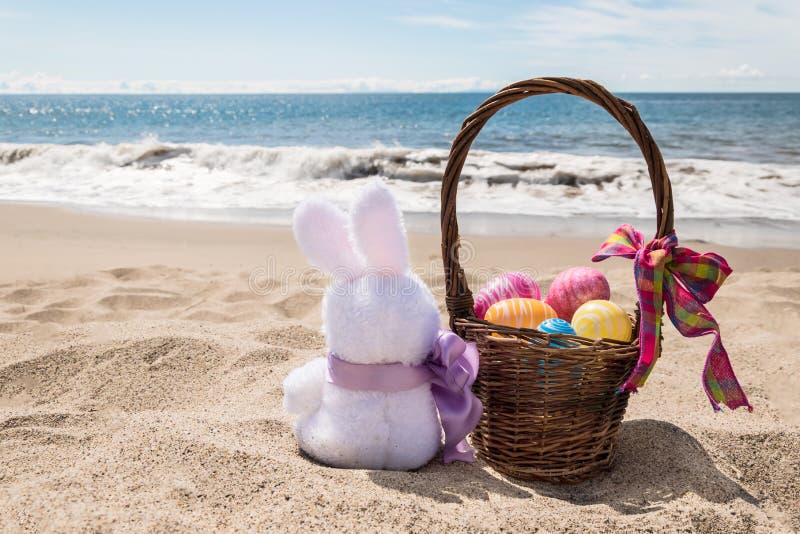 Easter Bunny with Color Eggs on the Ocean Beach Stock Photo - Image of ...