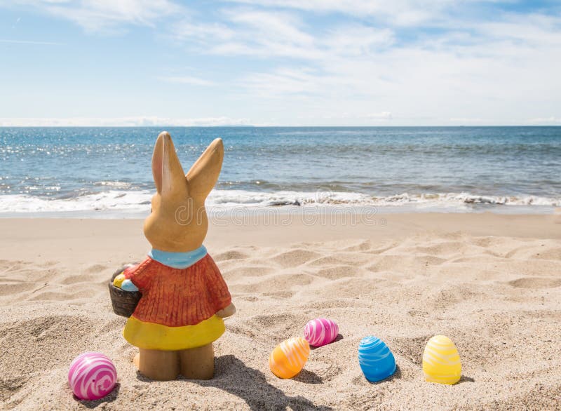 Easter Bunny with Color Eggs on the Ocean Beach Stock Image - Image of ...
