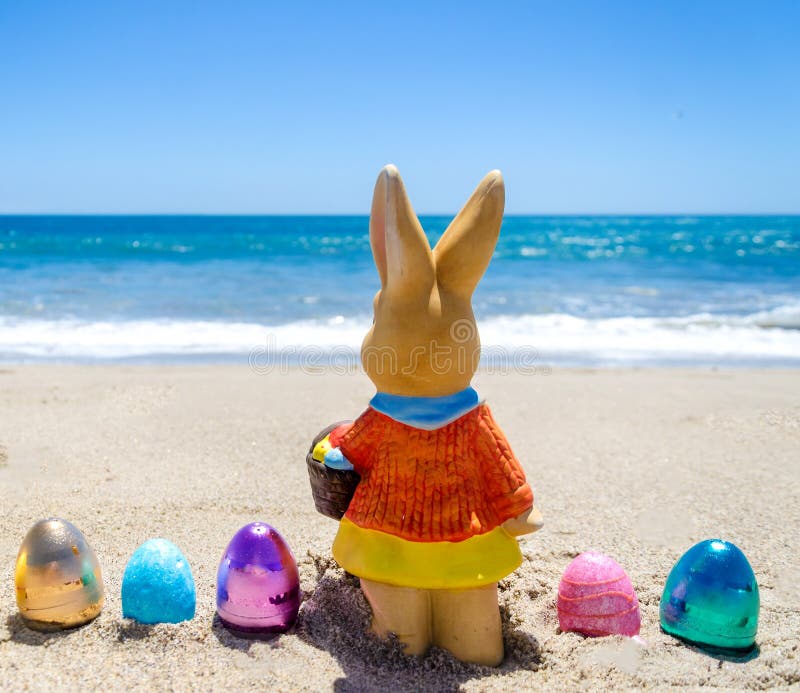 Easter Bunny with Color Eggs on the Ocean Beach Stock Photo - Image of ...