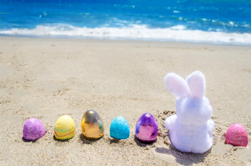 Easter Bunny with Color Eggs on the Ocean Beach Stock Photo - Image of ...