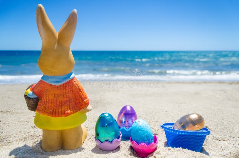 Easter Bunny with Color Eggs on the Ocean Beach Stock Photo - Image of ...