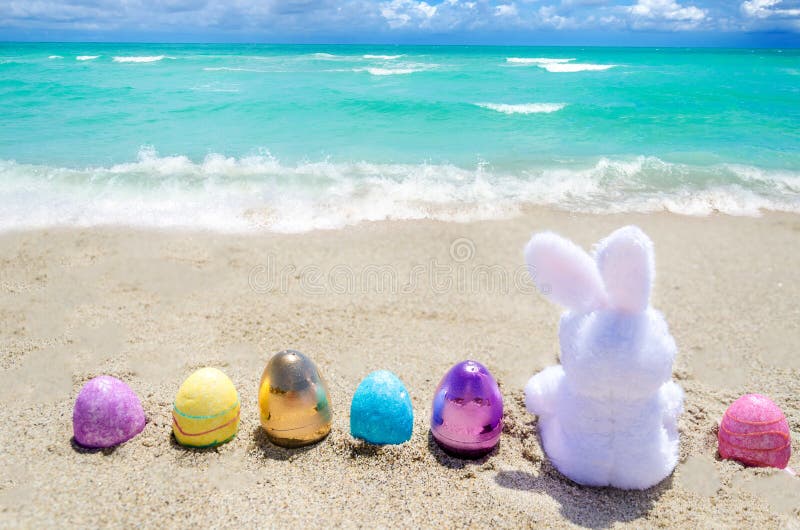 Bunny, Easter Eggs and Happy Easter Sign on a Beach Stock Photo - Image ...