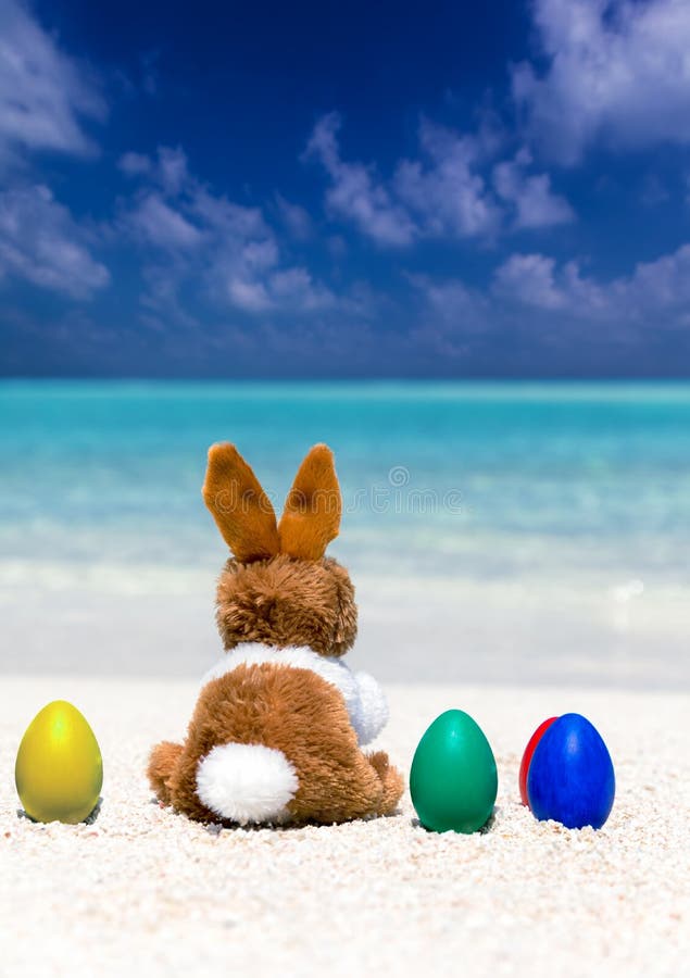 Easter Bunny with Colourful Easter Eggs on a Tropical Beach Stock Photo ...