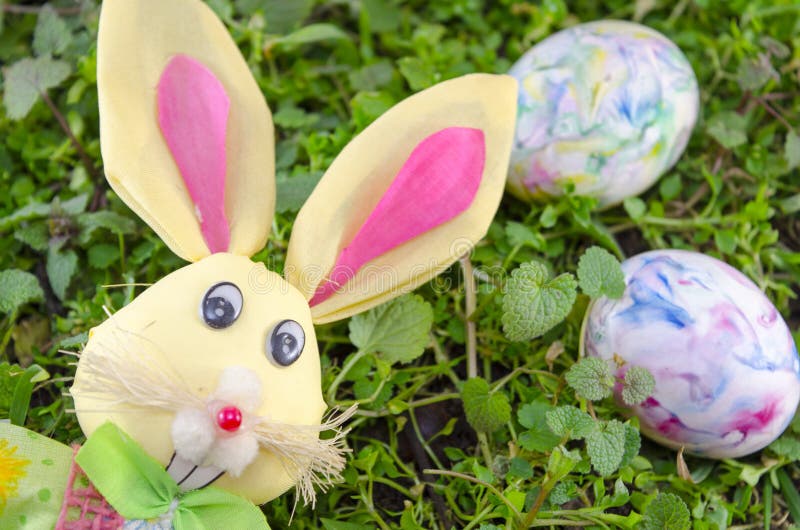 Easter Bunny and a Colored Egg on the Grass Stock Photo - Image of ...