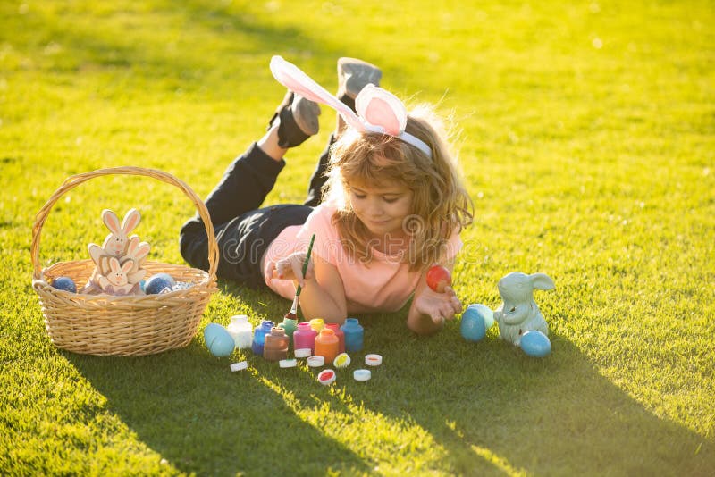 Easter Bunny Kids Painting Eggs. Child Boy in Bunny Easter Ears ...