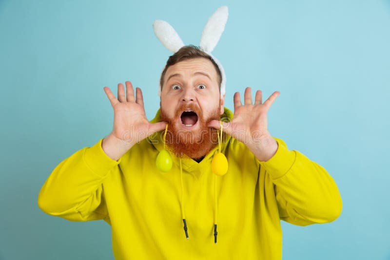 Easter Bunny Man with Bright Emotions on Blue Studio Background Stock ...