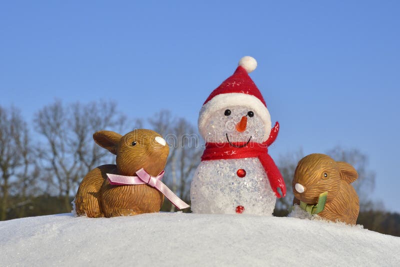 Easter bunny meets Snowman stock photo. Image of family - 85634848
