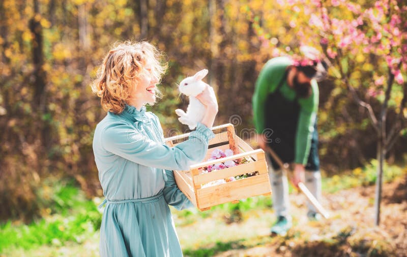 Easter Bunny. Portrait of Young Woman Posing with Rabbit. Stock Photo ...