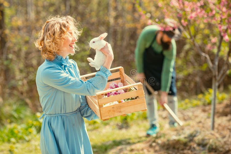 Easter Bunny. Portrait of Young Woman Posing with Rabbit. Stock Photo ...