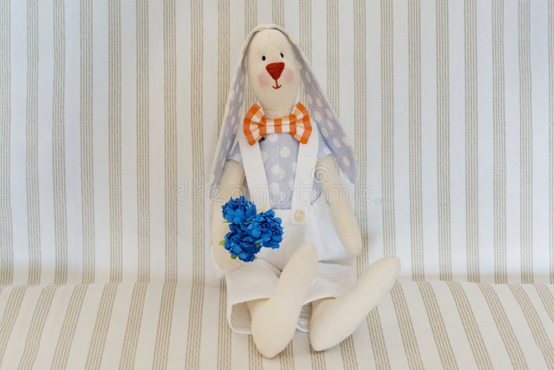 Easter Bunny Rabbit, Hand Maid Toy. on a Light Striped Background Stock ...