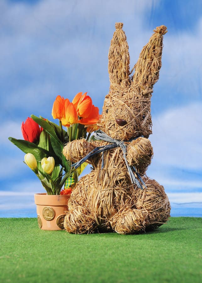 Easter Bunny from Straw with Flower Decoration Stock Photo - Image of ...