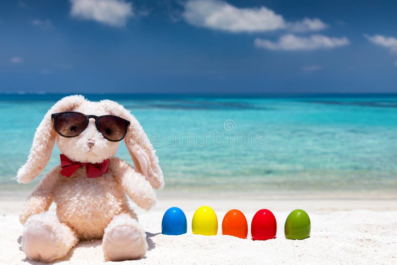 Easter Bunny with Colourful Easter Eggs on a Tropical Beach Stock Photo ...
