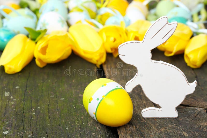 Easter Bunny hides eggs stock photo. Image of basket - 35809724
