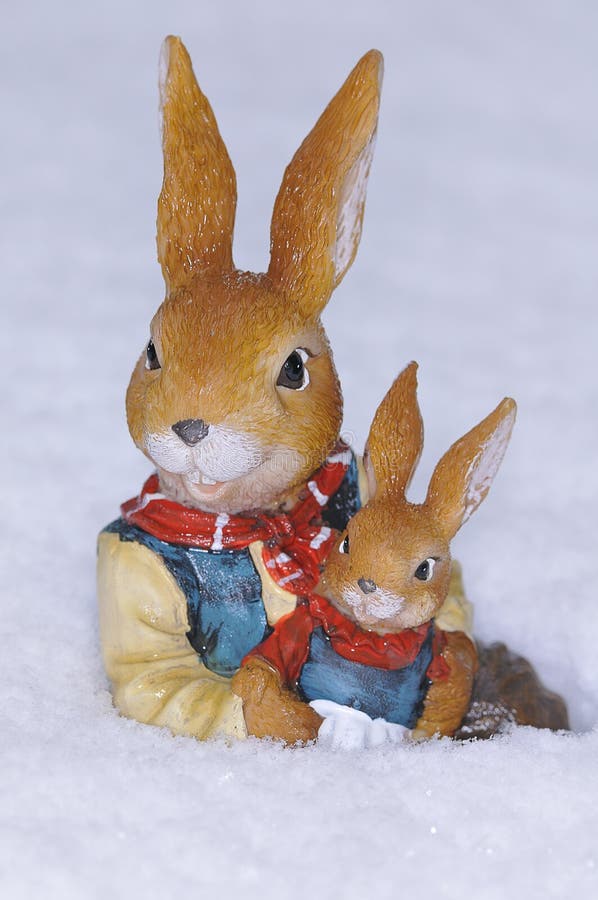 Easter bunny meets Snowman stock photo. Image of snow - 85634748