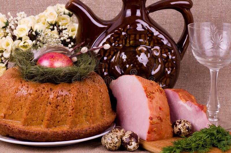 Easter Cake and Pork Loin Dish with Quail Eggs Stock Photo - Image of ...