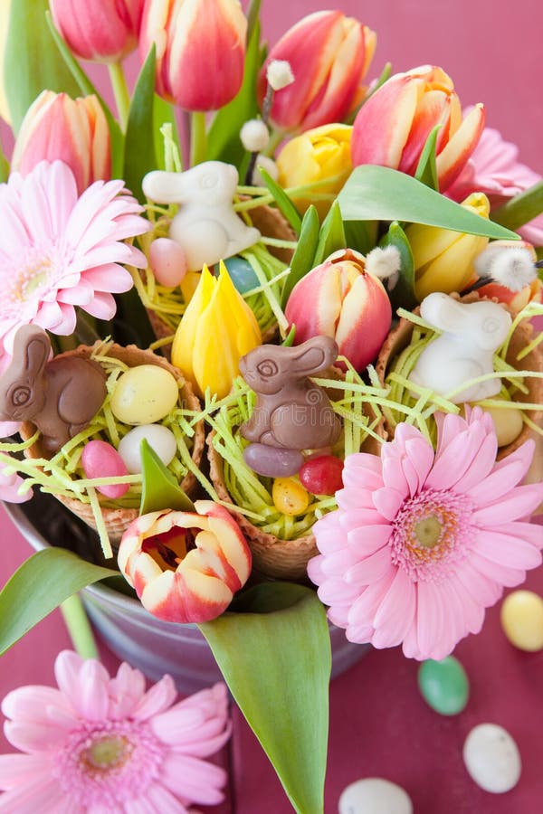 Easter Candy and Spring Flowers Stock Photo - Image of nest, cone: 89656666