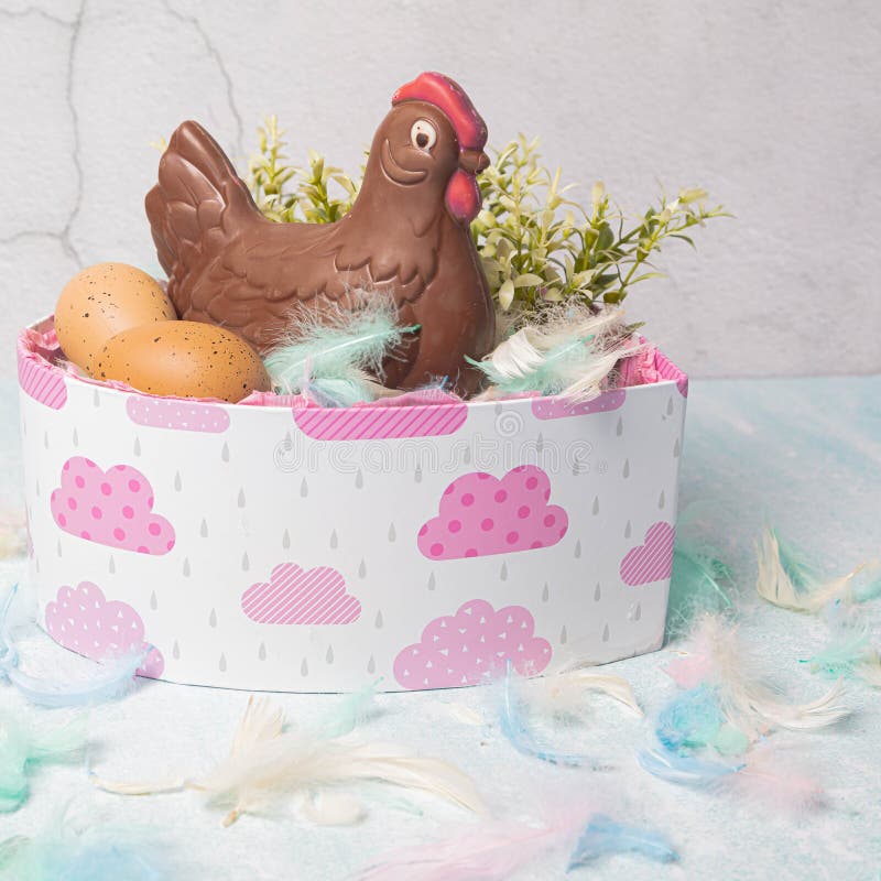 Easter Chocolate Chicken and Chicken Eggs in a Pink Box and Colored ...