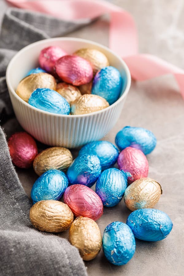Easter Chocolate Eggs Wrapped in Aluminium Foil on Kitchen Table Stock ...