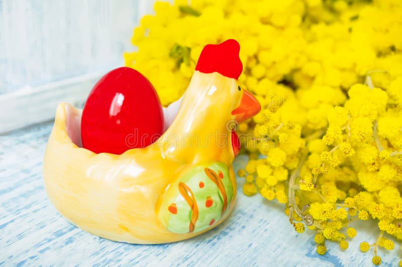 Easter Composition. a Red Painted Egg in a Ceramic Chicken with a ...