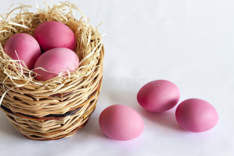 Easter Composition with Wicker Basket and Pink Colored Eggs Stock Image ...