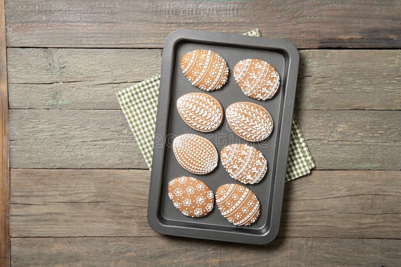 Easter Cookies on a Baking Sheet on an Old Wooden Background Stock ...