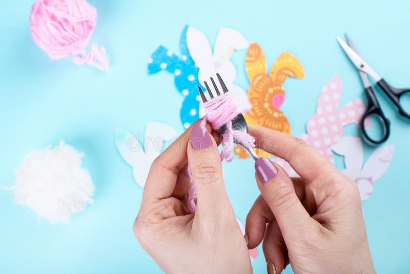 Easter Craft of Making Yarn Bunny Tail with a Fork Stock Photo - Image ...