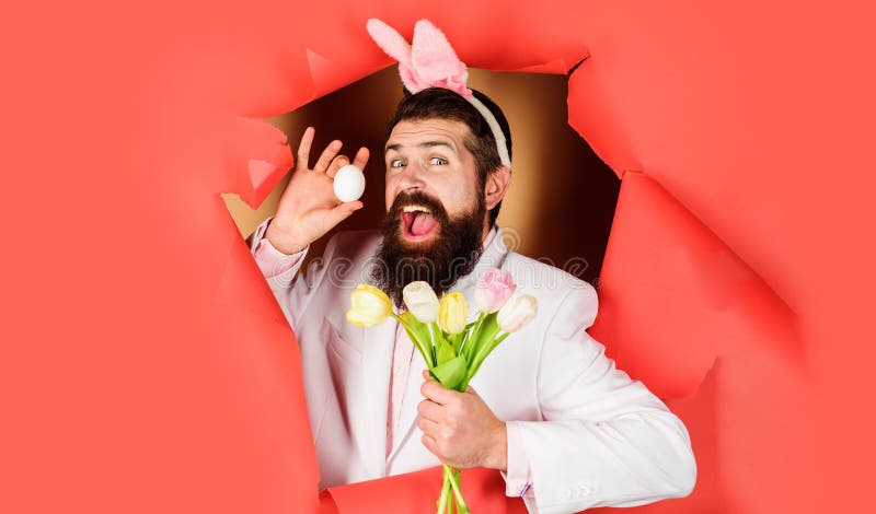 Easter Day. Happy Bearded Man with Easter Egg and Flowers. Rabbit Guy ...