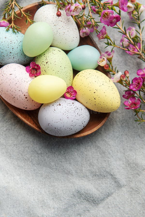 Easter Decor. Colored Easter Eggs on a Wooden Plate on the Table Stock ...