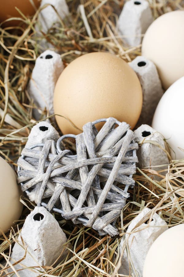 Simple Easter Decoration with Eggs, Hay and Wicker Heart Stock Image ...