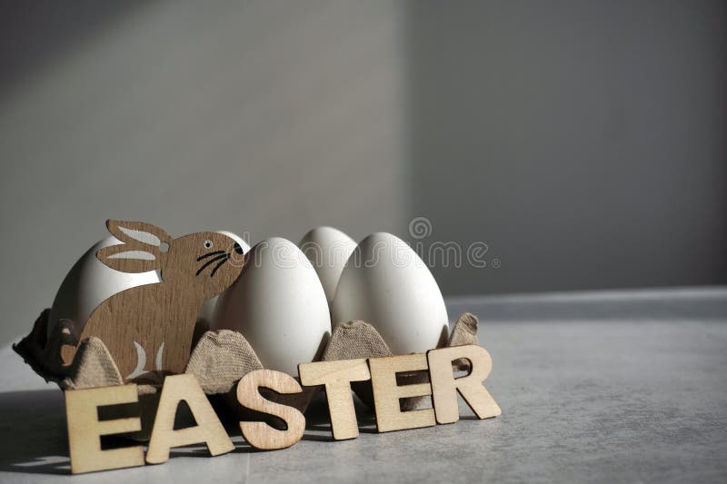 Easter Decor with Wooden Bunny, the Caption and Eggs in Paper Box Stock ...