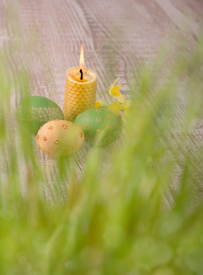 Easter Decorations with Burning Candle on Wooden Background Stock Image ...