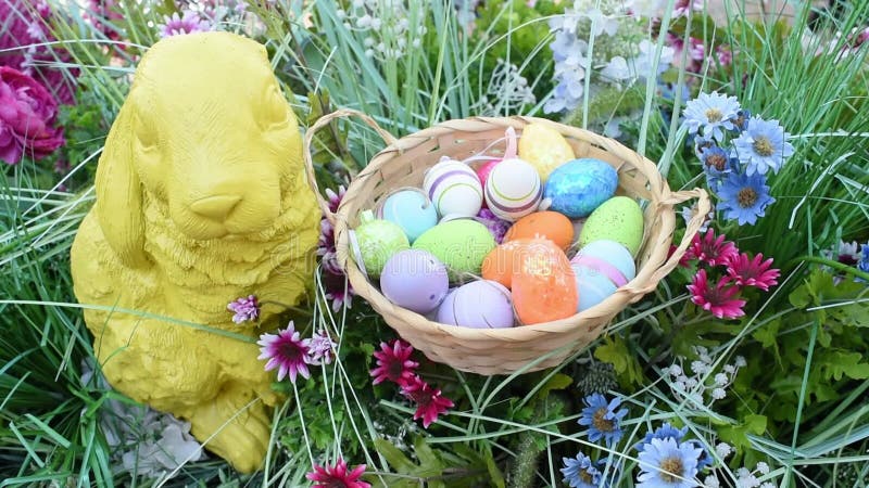 Easter Decorations. a Yellow Rabbit Figure Next To Easter Eggs Stock ...