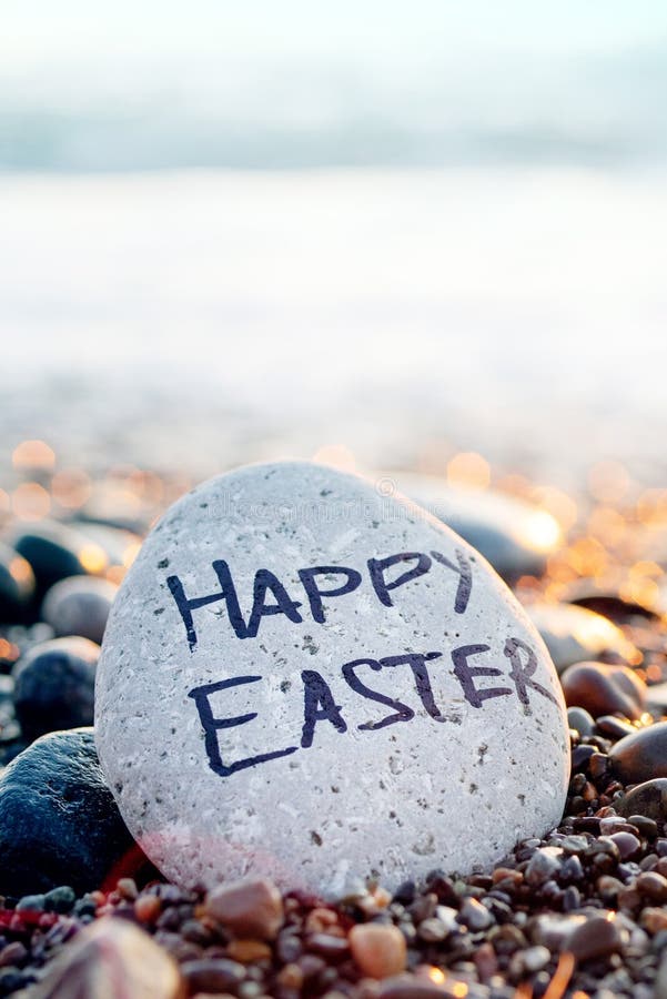 Easter Egg Made of Stone with the Inscription "Happy Easter" on the Sea ...