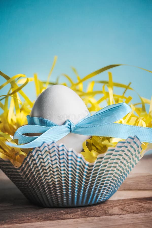 Easter Egg Nestled Against a Bright Blue Background Stock Photo - Image ...