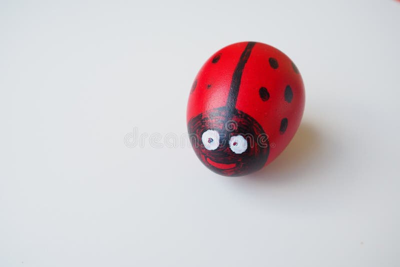 Easter Egg Painted Red, White and Black with a Cheerful Face of Ladybug ...