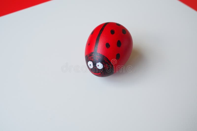 Easter Egg Painted Red, White and Black with a Cheerful Face of Ladybug ...